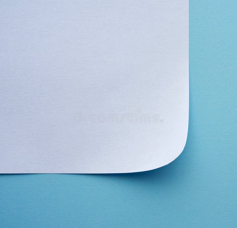 Wrapped Sheet of White Paper on a Blue Background Stock Photo - Image ...