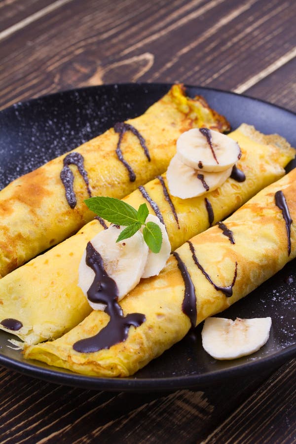 Wrapped Thin Pancakes with Filling, Served with Bananas Stock Photo ...