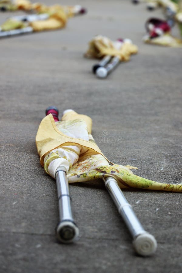 Wrapped Yellow Color Guard Flags on Sidewalk Stock Image - Image of ...