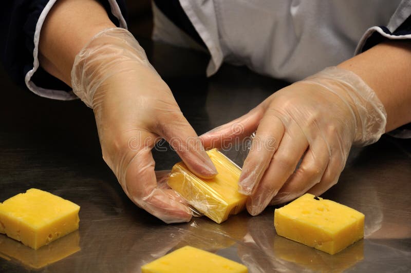 Wrapping the cheese stock photo. Image of food, hygiene - 48608166