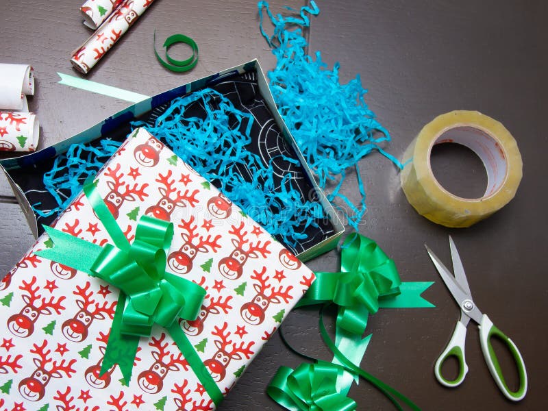 Wrapping Gift with Scissors, Tape and Paper Stock Photo - Image of ...