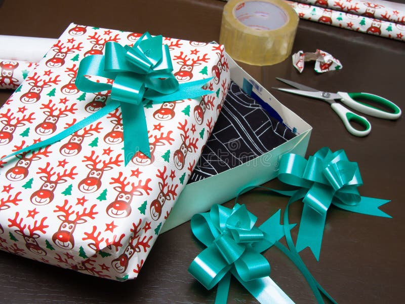 Wrapping Gift with Scissors, Tape and Paper Stock Photo - Image of ...