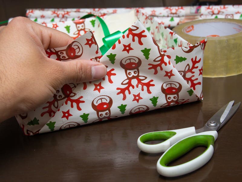 Wrapping Gift with Scissors, Tape and Paper Stock Photo - Image of ...
