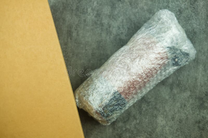 Wrapping an Item in Bubble Wrap Stock Image - Image of material ...