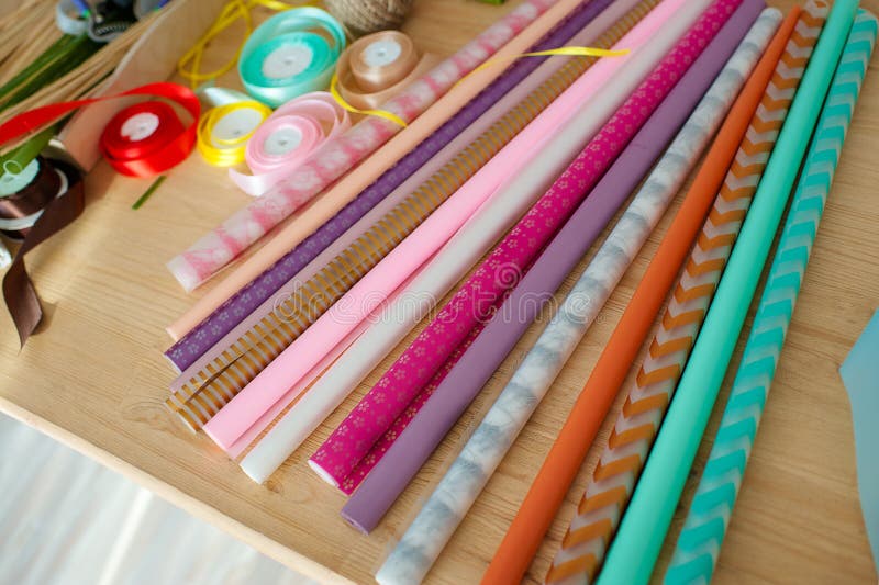 Paper for Packing Flowers on the Table. Florist`s Workplace. Process of ...