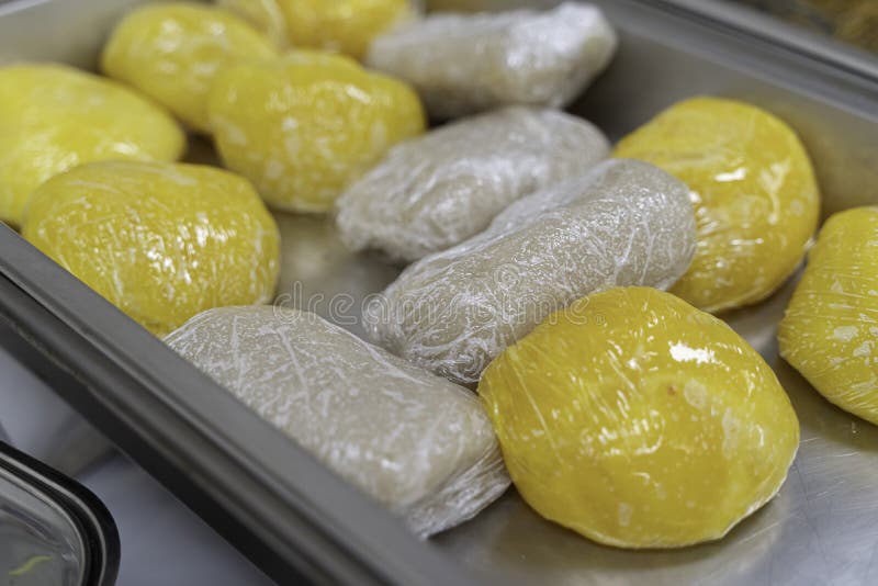 Wraps of White and Yellow Eba -Garri in Chaffing Dish at Party Stock ...