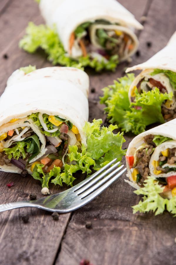 Wraps on wooden background stock image. Image of wood - 33121345