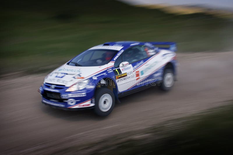 Rally car jumping editorial stock photo. Image of navigator - 4883018