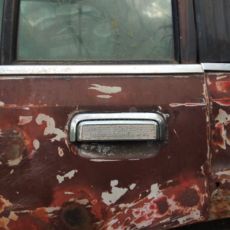 A Wrecked Car Overgrown with Weeds on the Edge Stock Image - Image of ...