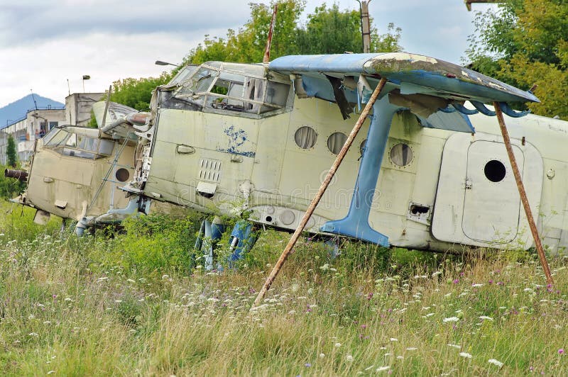 Airplanes Wreckages in Green Grass. Cemetery of Airplanes Stock Image ...