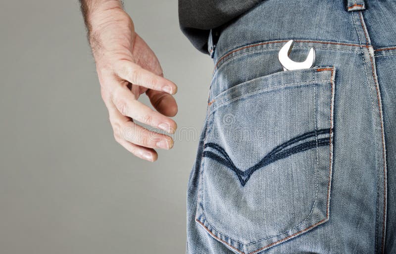 Wrench in the back pocket stock photo. Image of shirt - 179863392