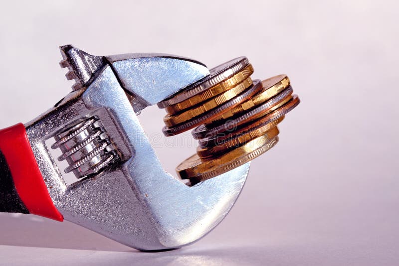 Wrench and Coins . the Concept of Financial Reliability Stock Photo ...