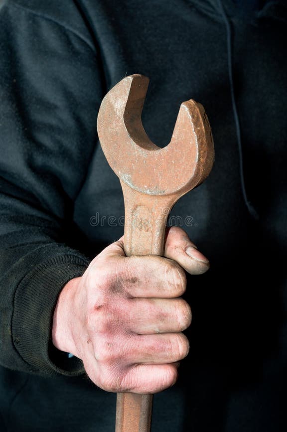 Wrench in hand stock image. Image of metallic, hand, rusty - 17240453