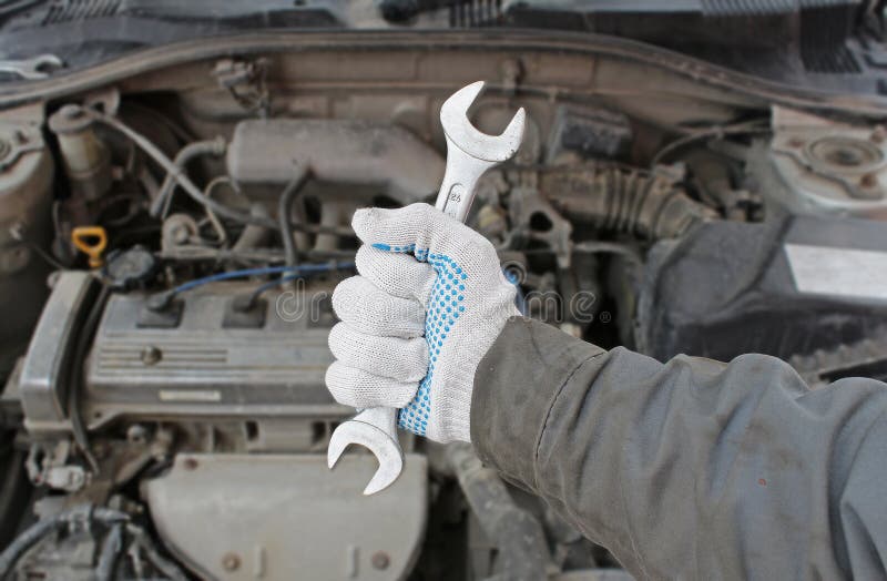 Wrench in the hand stock image. Image of station, help - 68496633
