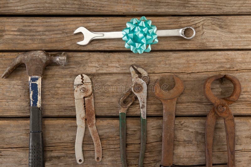 Wrench with Ribbon by Hand Tools on Wooden Table Stock Photo - Image of ...