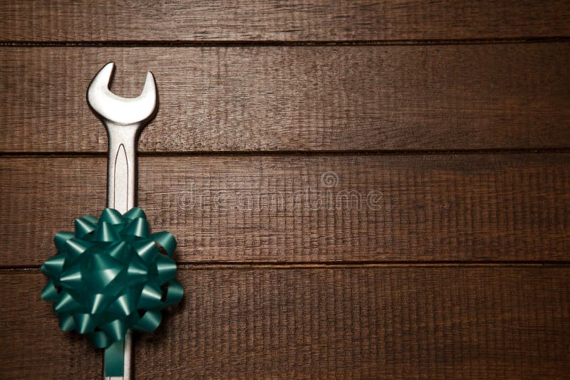 Wrench with Ribbon on Table Stock Photo - Image of tool, hand: 93241484