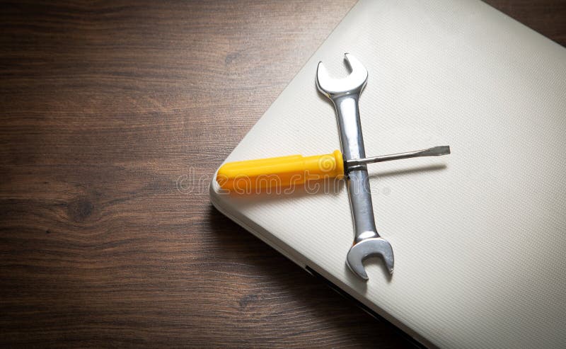 Wrench and Screwdriver with a Laptop Computer. it Service Stock Image ...
