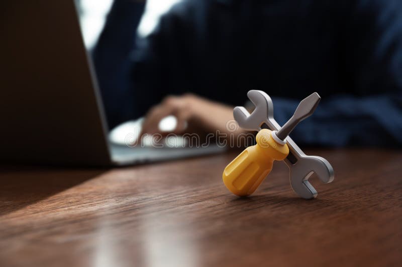 Wrench and Screwdriver Put on Table in Front of Businessman or it ...