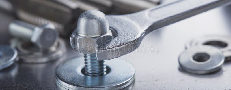 Wrench Tightens Steel Cap Nut in Steel Billet. Spanner, Bolt, and Nuts ...
