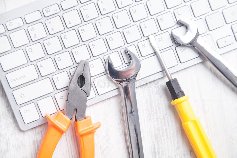 Wrenches on the Computer Keyboard. it Service Stock Photo - Image of ...