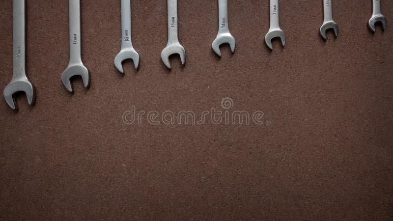 Wrenches Lined Up According To Size on Top of Wooden Board Stock Photo ...