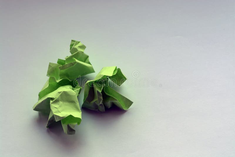 Wrinkled Green Paper on a White Table. Crumpled Notes of Failed ...