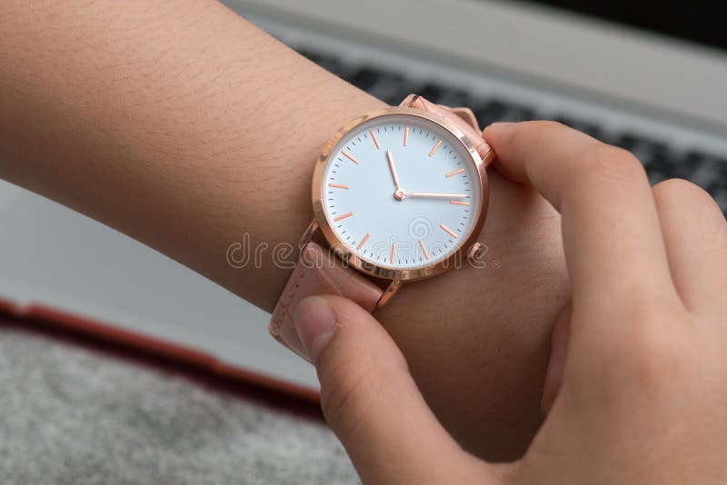 Wrist Watch on Girl`s Hand in Front of a Notebook Computer Stock Image ...