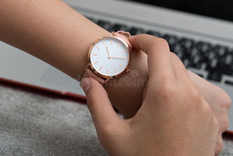 Wrist Watch on Girl`s Hand in Front of a Notebook Computer Stock Photo ...