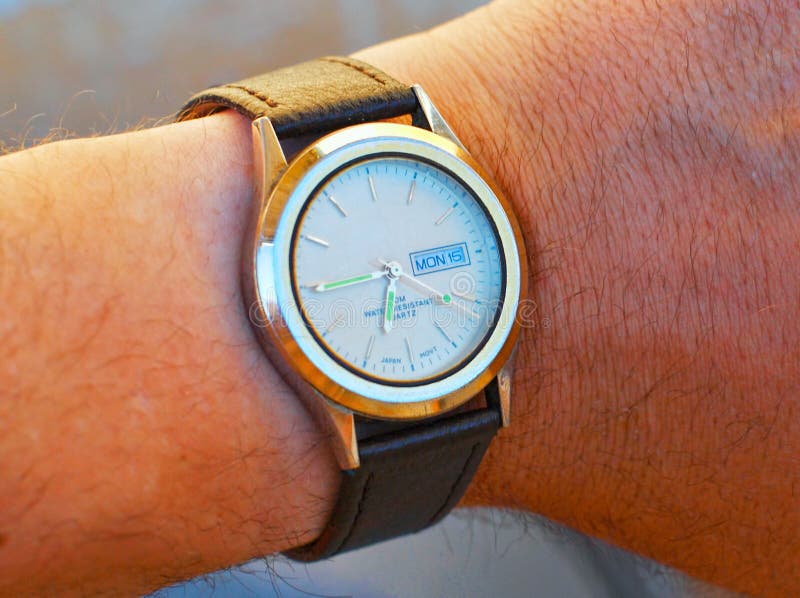 Wrist watch showing time stock image. Image of wrist - 145058327