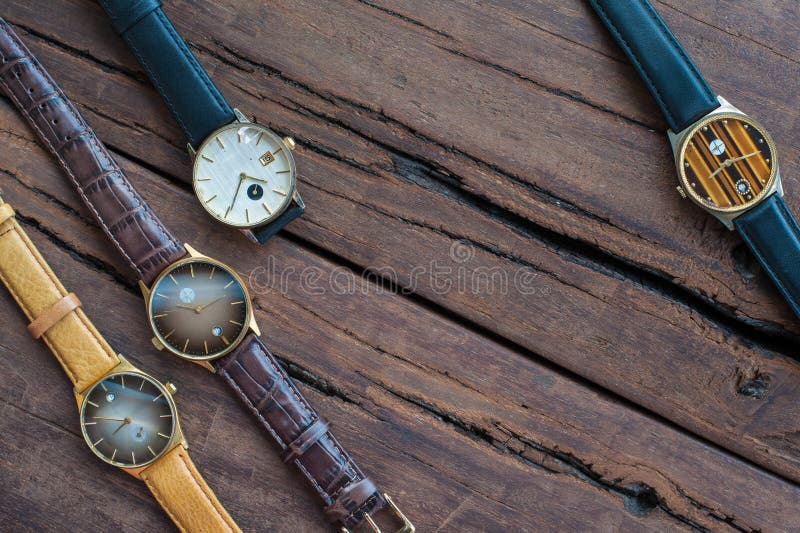 Wrist Watches on a Wooden Table Stock Photo - Image of bracelet, hand ...