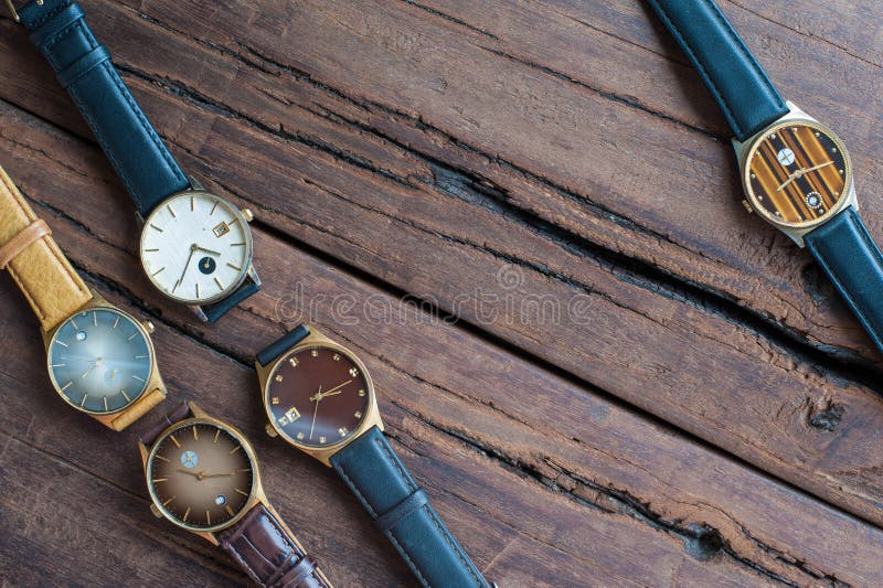 Wrist Watches on a Wooden Table Stock Photo - Image of bracelet, hand ...
