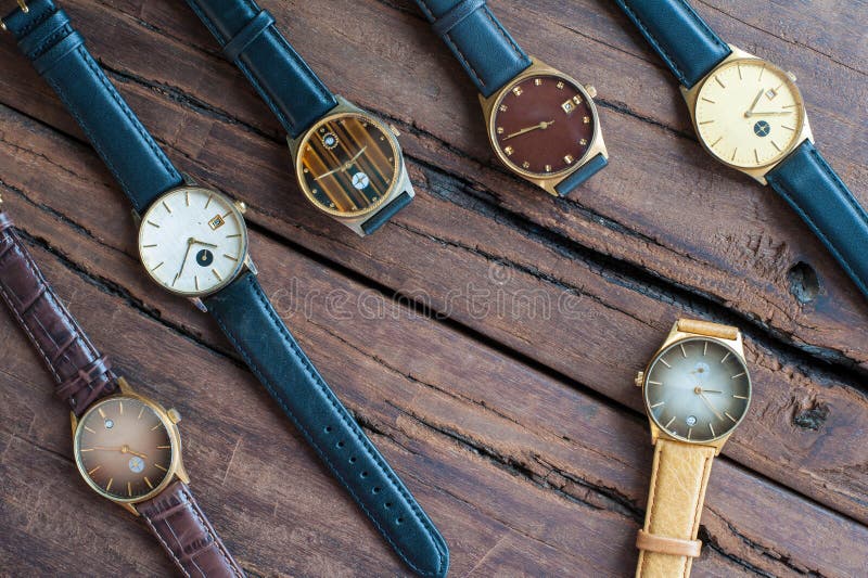 Wrist Watches on a Wooden Table Stock Photo - Image of minute, timer ...