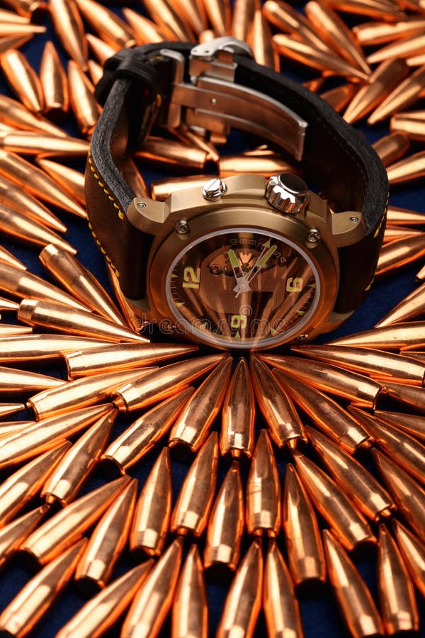 Wristwatch on bullets stock image. Image of wristwatch - 21000915