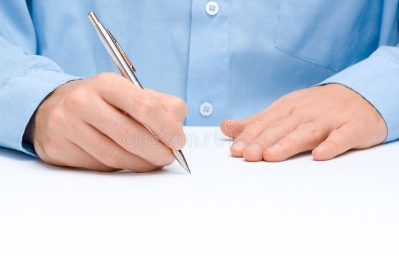 The Hands of the Criminal in Handcuffs Write with a Pen on Paper. Stock ...