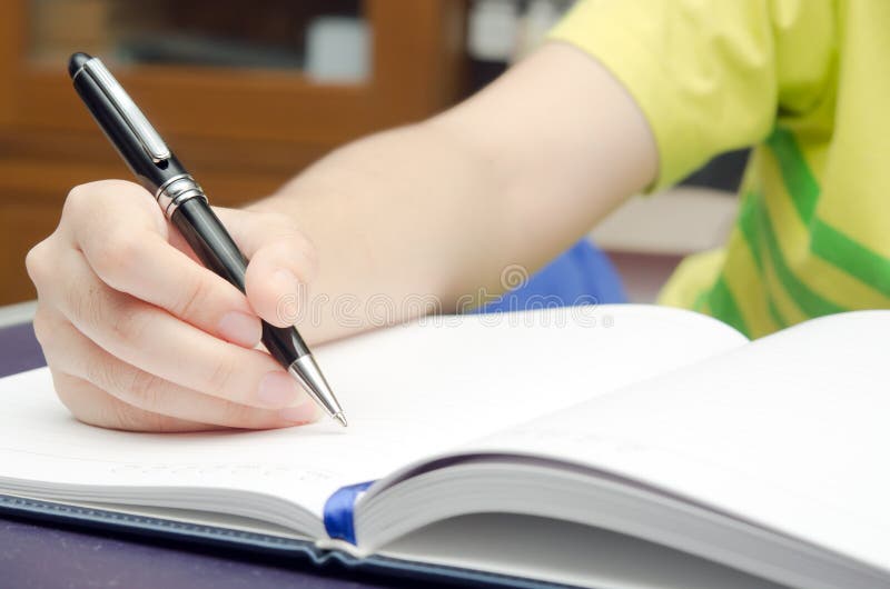 Write Activity with a Pen and a Book Filtered with Morning Light Stock ...