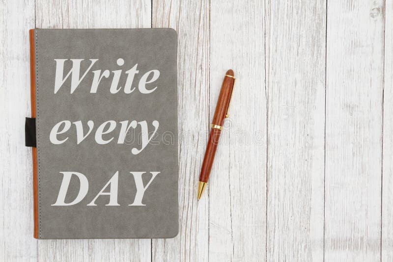 Write Every Day Message on a Leather Book with Pen Stock Photo - Image ...