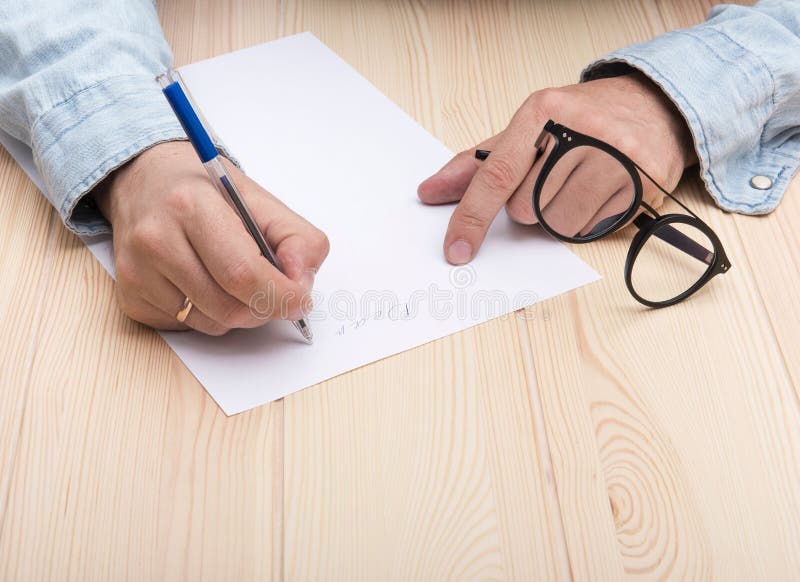 Write a Letter. in the Hands of a Man is a Ballpoint Pen and he Writes ...