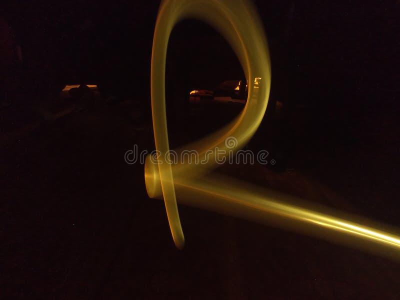 Write the Letter R Using Light Painting Techniques, with Yellow Lights ...