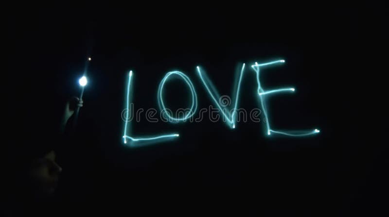 Write Love in Radiant Light â€“ a Person Holding LED Wand in Darkness ...