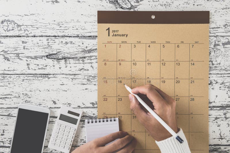 Write a Schedule To a Calendar Placed on a Table Stock Image - Image of ...