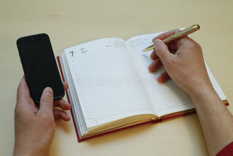 Write To a Notebook from Your Phone Stock Image - Image of workplace ...