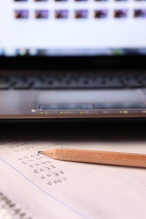 Writen Notebook , Pencil and a Laptop in the Backgound Stock Image ...