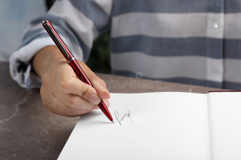 Writer Signing Autograph in Book at Table Stock Image - Image of fame ...