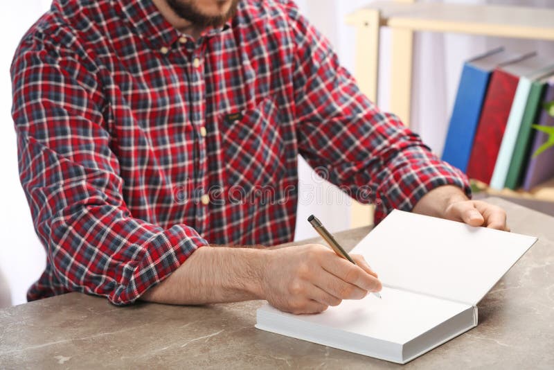 Writer Signing Autograph in Book at Table Stock Image - Image of paper ...