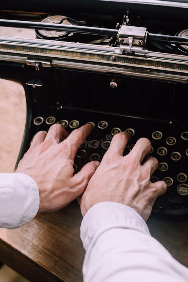 A Writer Using a Vintage Typewriter, Writing His Next Novel Stock Photo ...