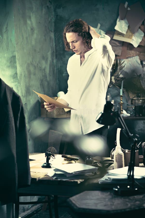 Writer at Work. Handsome Young Writer Standing Near the Table and ...