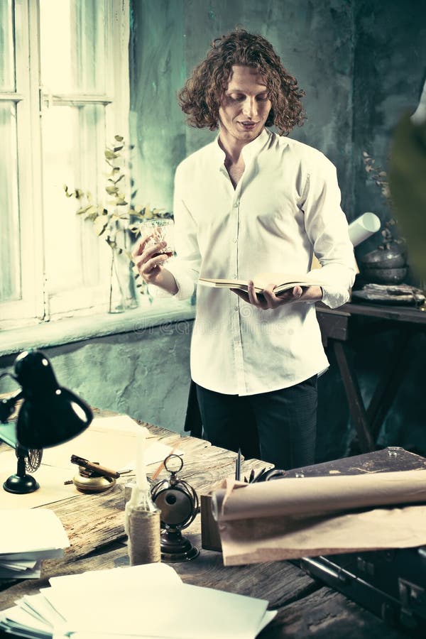 Writer at Work. Handsome Young Writer Standing Near the Table and ...