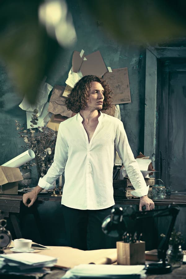 Writer at Work. Handsome Young Writer Standing Near the Table and ...