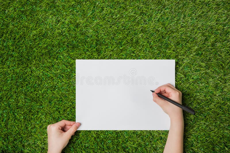 Writing on Blank Sheet of Paper Over Green Grass Stock Image - Image of ...