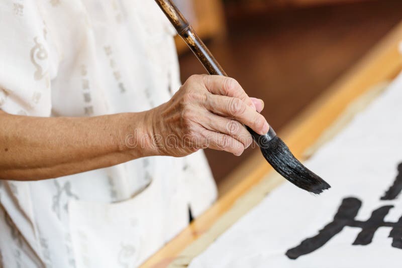 Man Writing Chinese Calligraphy Stock Photo - Image of paintbrush ...